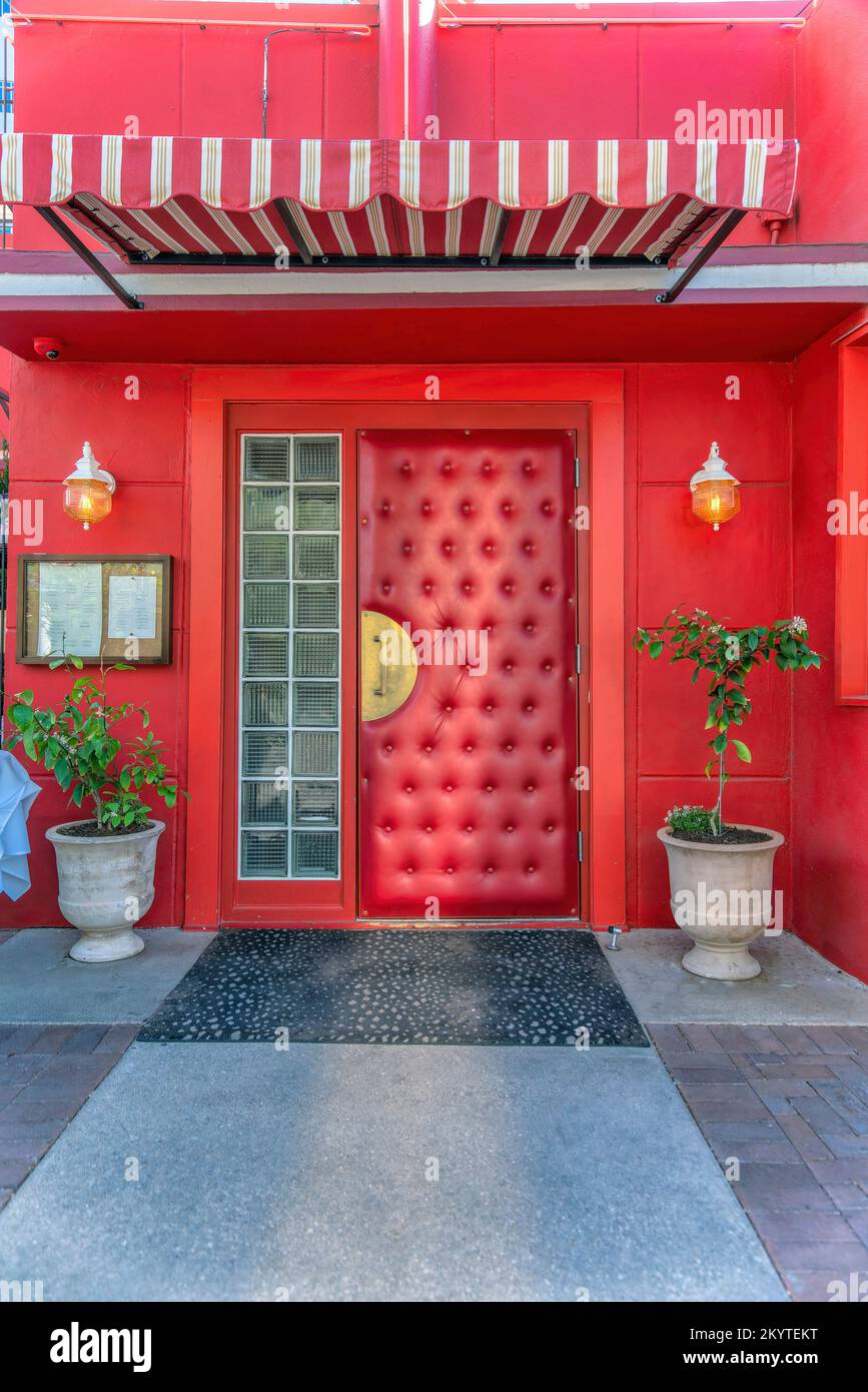 Upholstered red front door with side panel with glass cubes panel ...