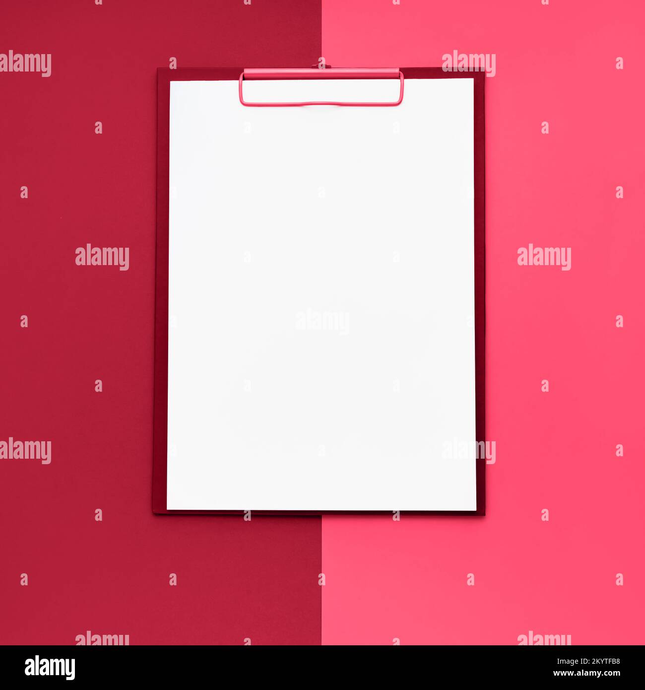Blank clipboard mockup on red viva magenta color background. Top view ...