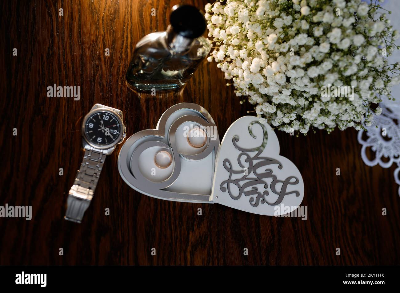 Wedding accessories. Wedding invitation, a pair of gold wedding rings ...