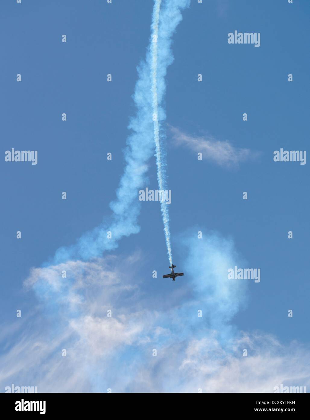 Aerobatics scenery showing a flying propeller-driven airplane with ...