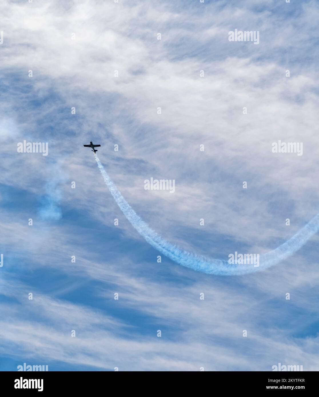 Aerobatics scenery showing a flying propeller-driven airplane with ...