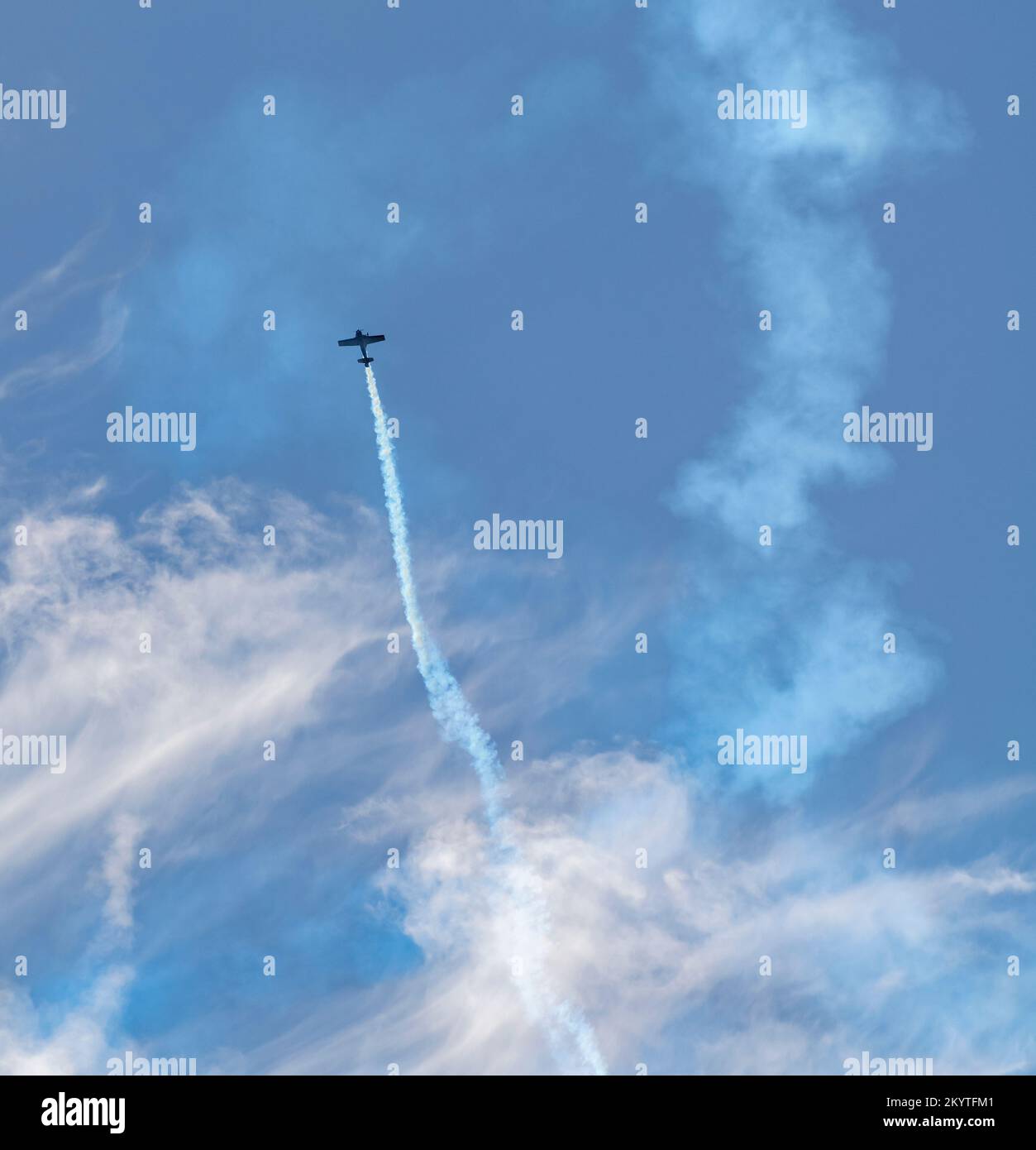 Aerobatics scenery showing a flying propeller-driven airplane with ...