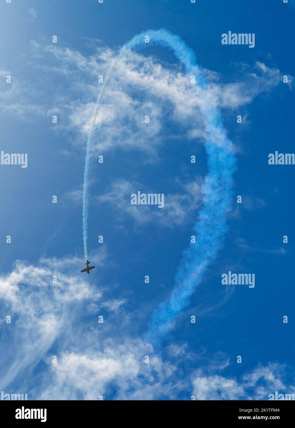 Aerobatics scenery showing a flying propeller-driven airplane with ...