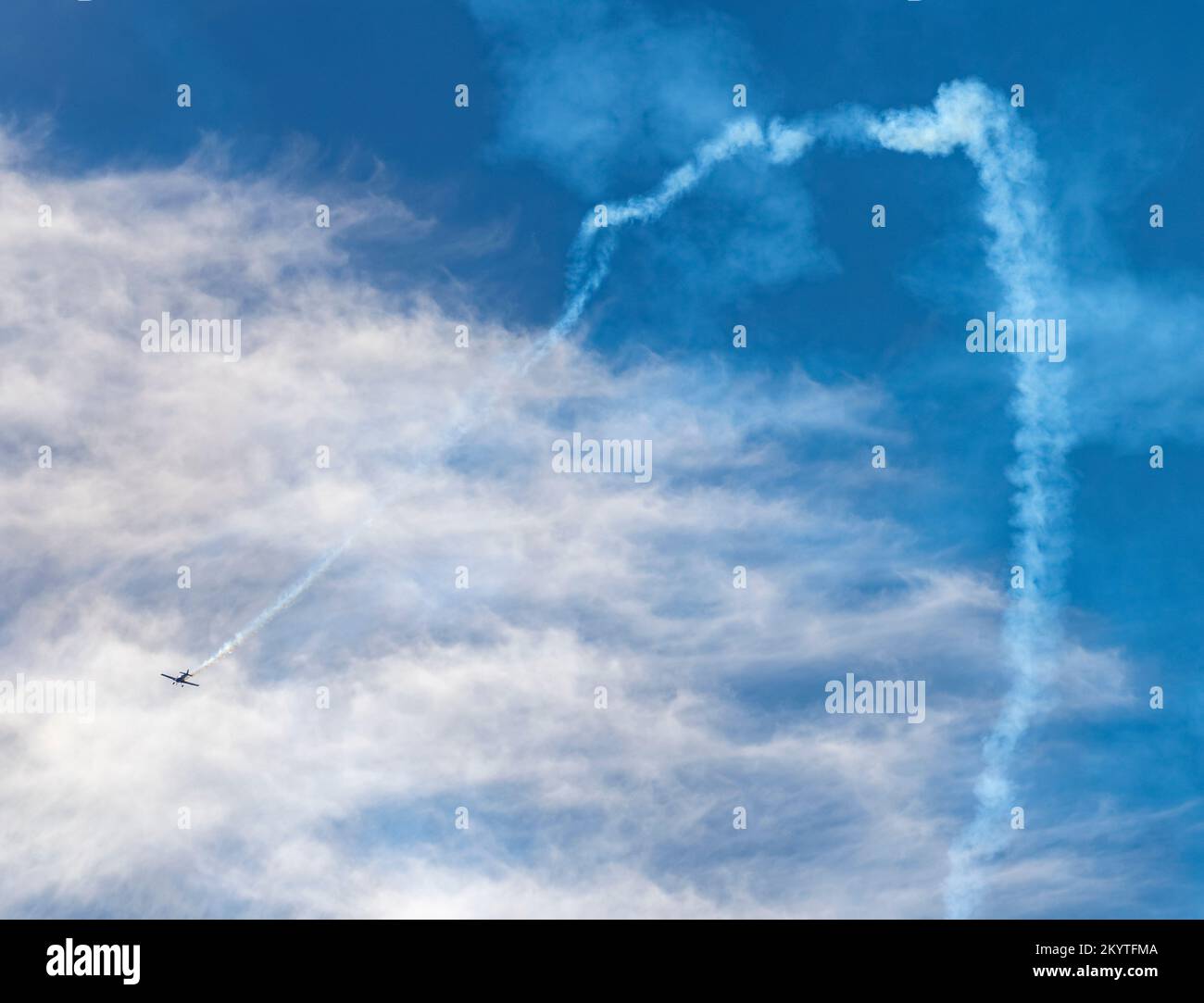 Aerobatics scenery showing a flying propeller-driven airplane with ...