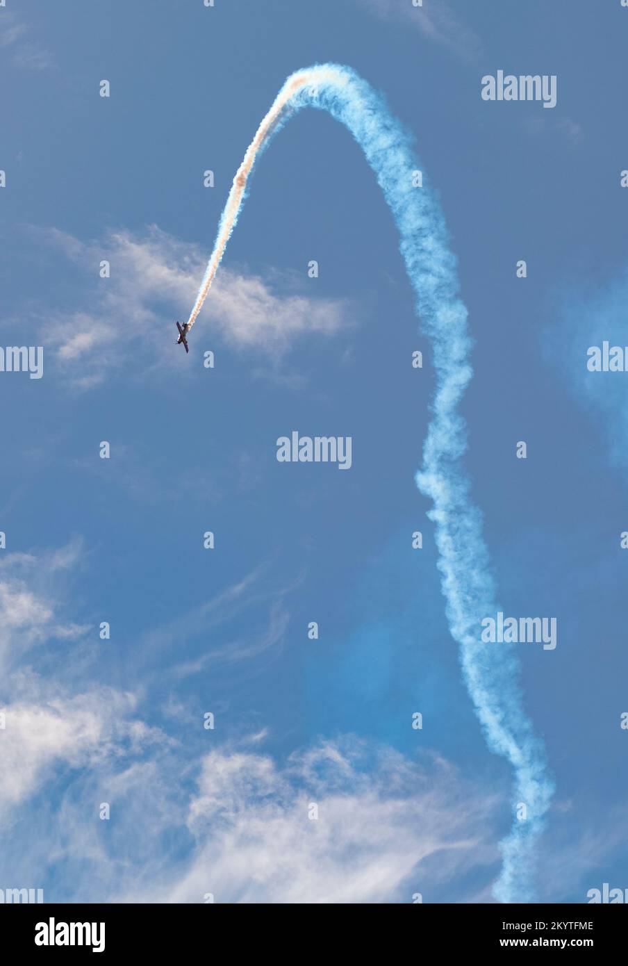 Aerobatics scenery showing a flying propeller-driven airplane with ...