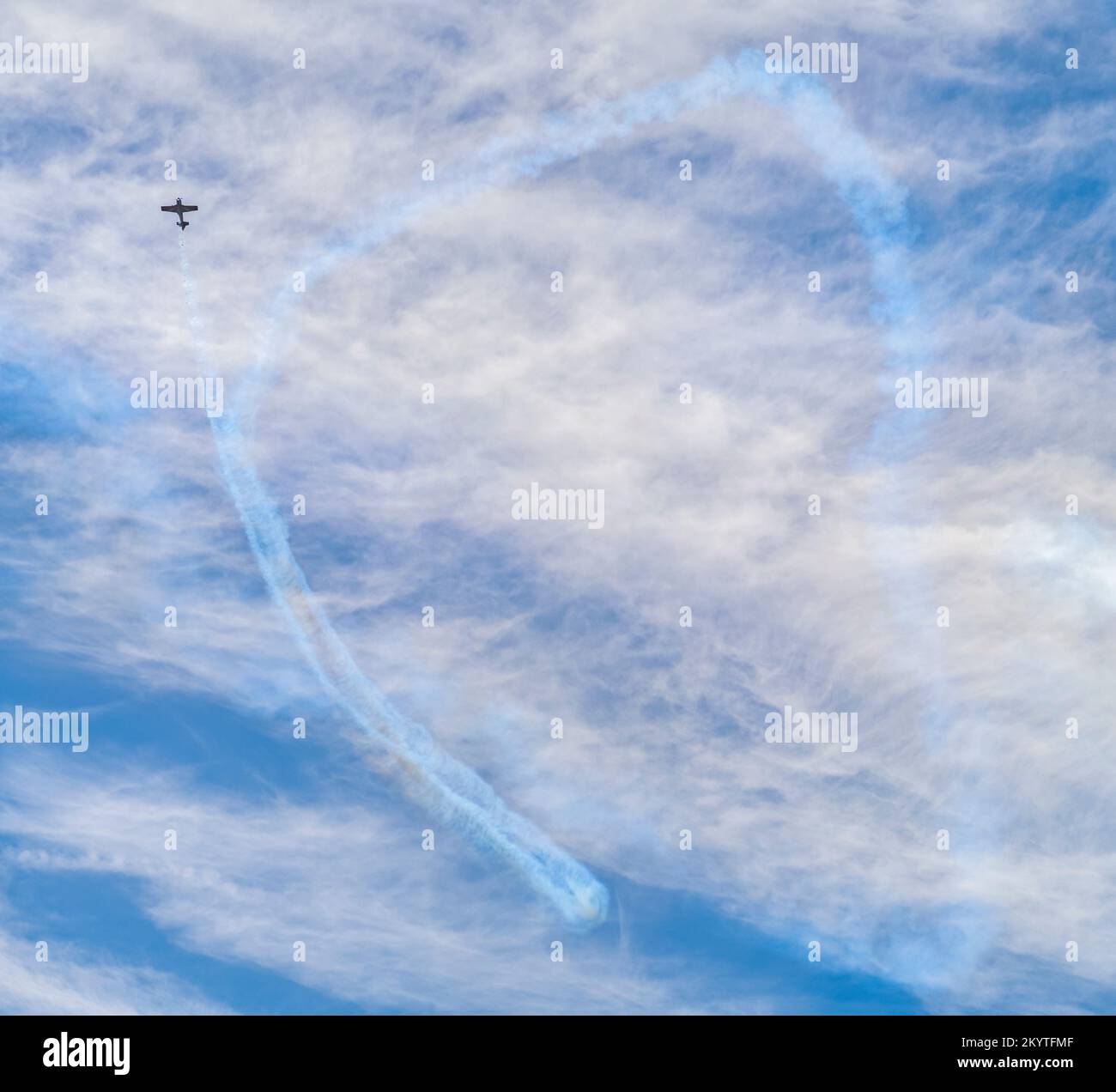 Aerobatics scenery showing a flying propeller-driven airplane with ...