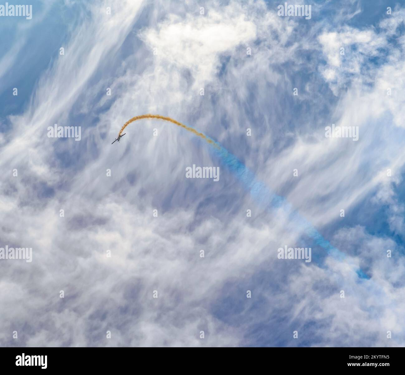 Aerobatics scenery showing a flying propeller-driven airplane with ...