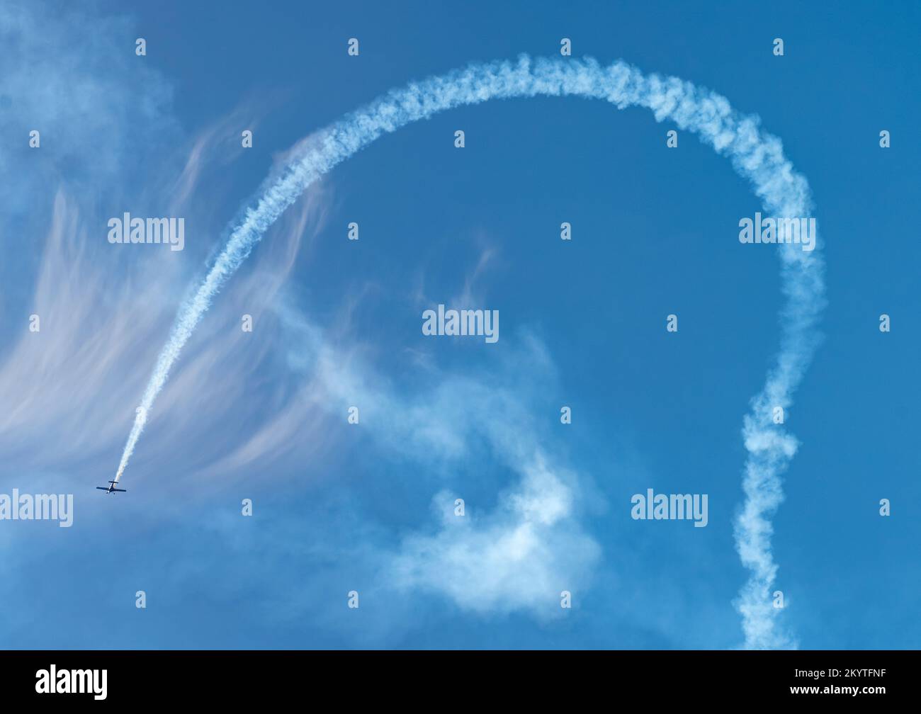 Aerobatics scenery showing a flying propeller-driven airplane with ...