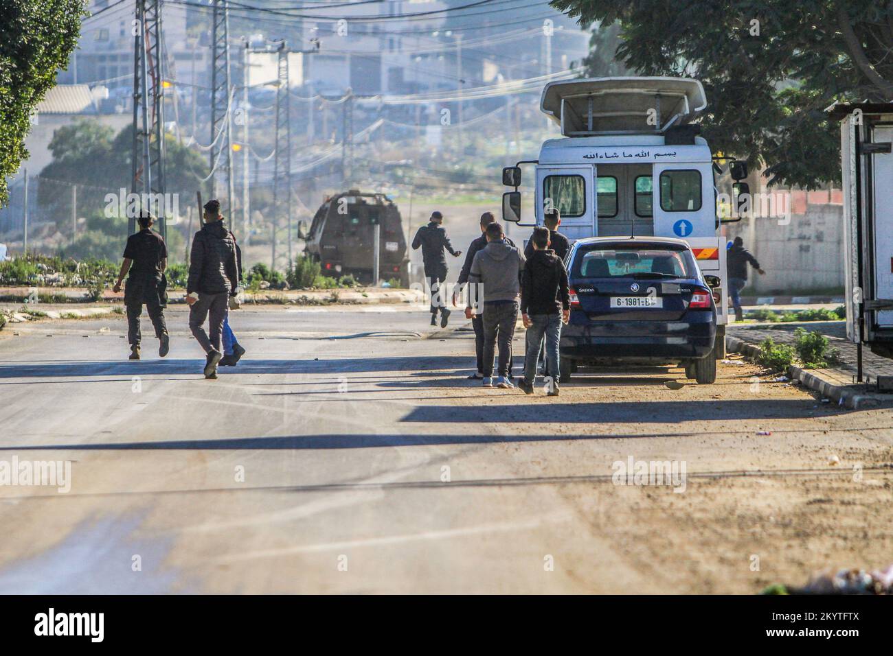 Nablus, Palestine. 02nd Dec, 2022. Palestinian youths throw stones at ...