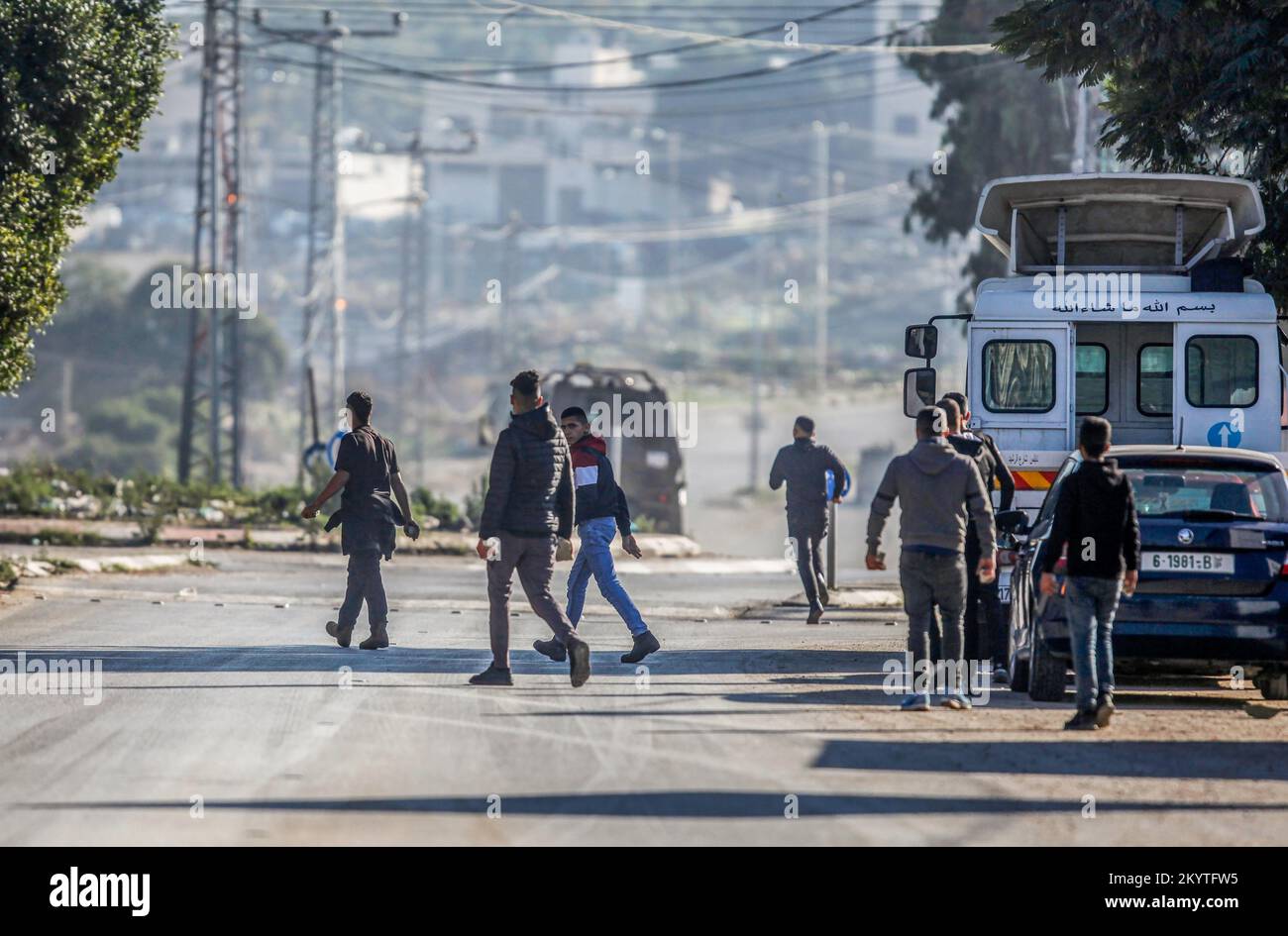 Nablus, Palestine. 02nd Dec, 2022. Palestinian youths throw stones at ...