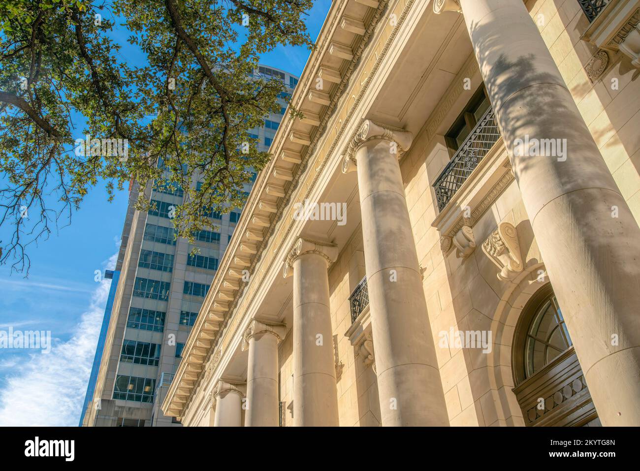 Austin, Texas- Ancient roman and high-rise buildings in a low angle ...