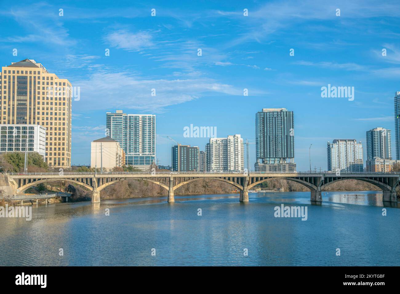 Austin, Texas- bridge over the Colorado River below the cityscape views ...
