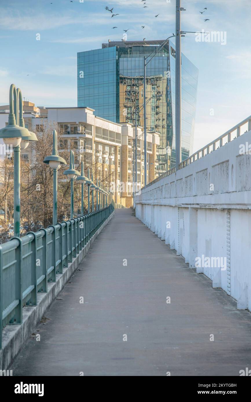 Austin, Texas- Bridge sidewalk with lamp posts over the Colorado River ...