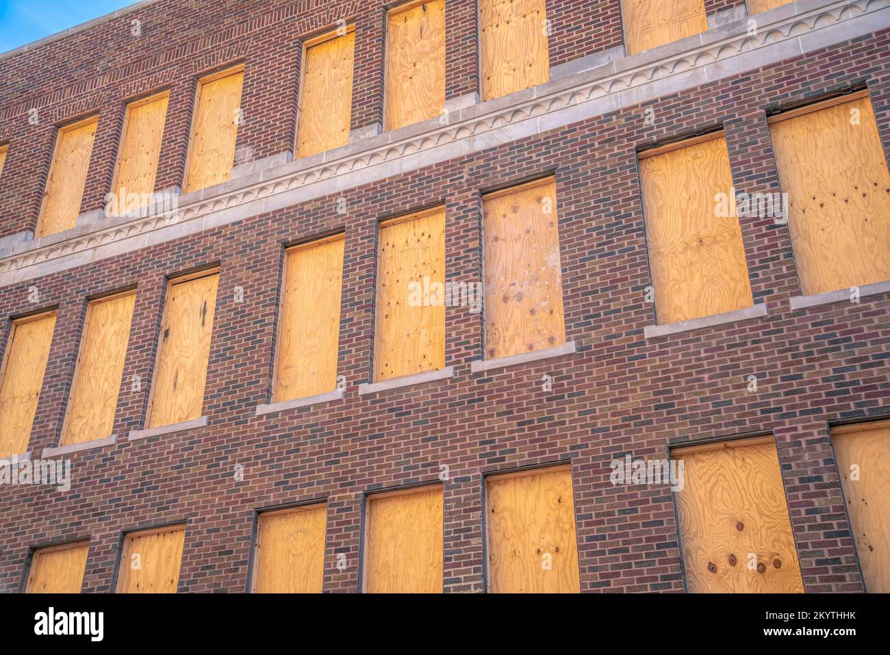 Building wall with red bricks and windows with wood panels- San Antonio ...