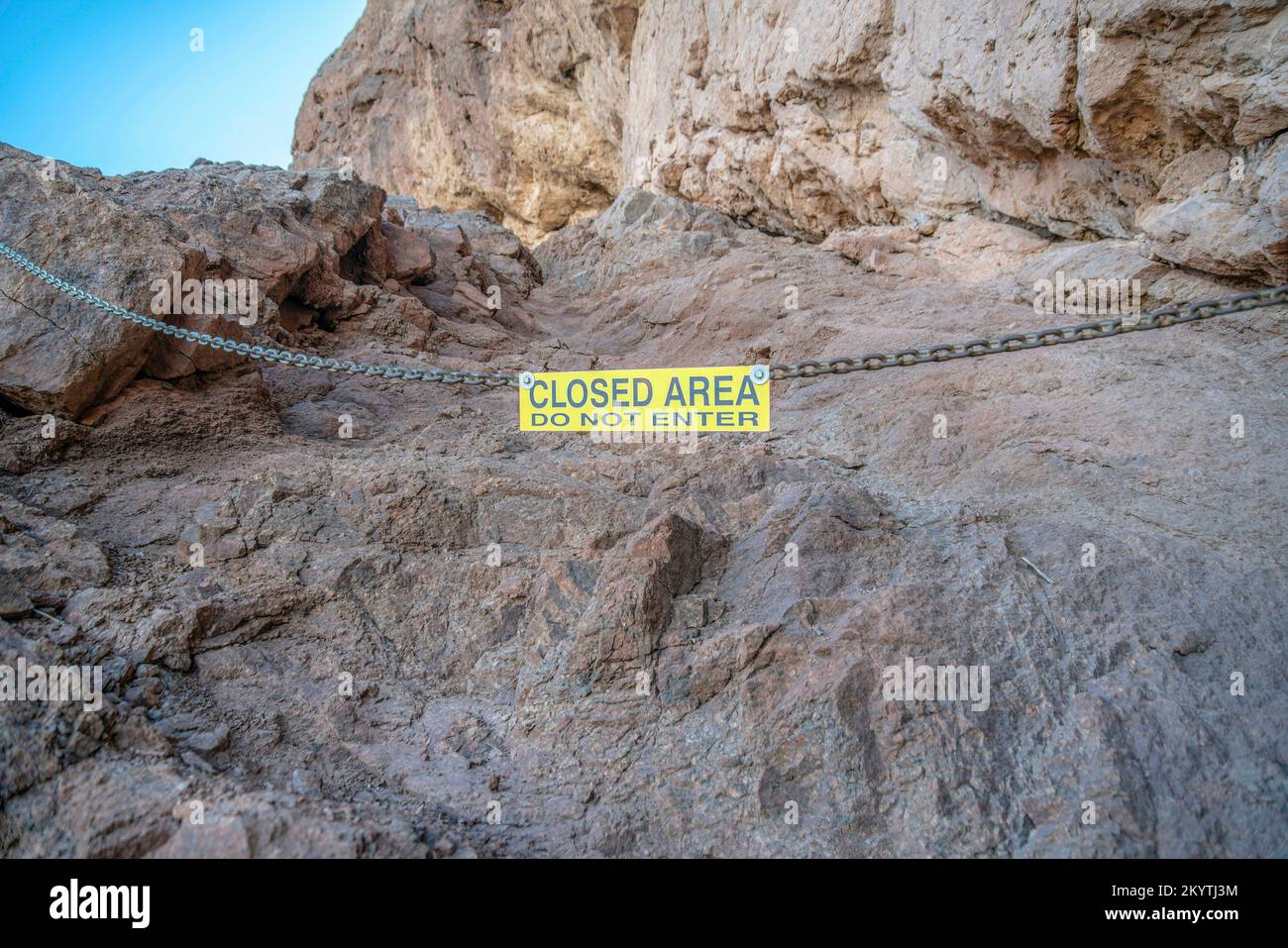 Phoenix, Arizona- Sign hanging on a chainlink against the rock mountain ...