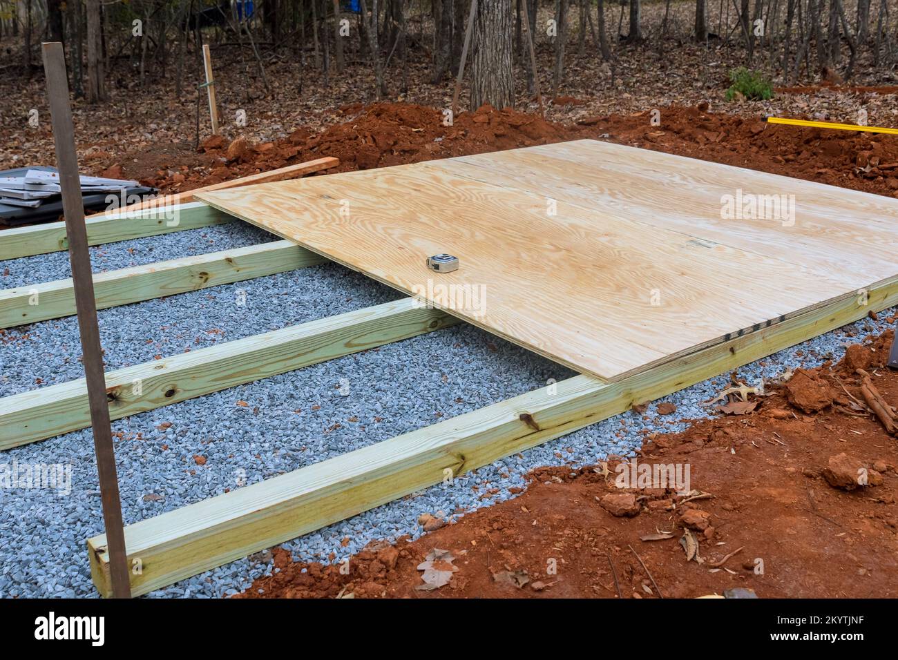 To build wooden deck foundation in backyard to support small shed Stock ...