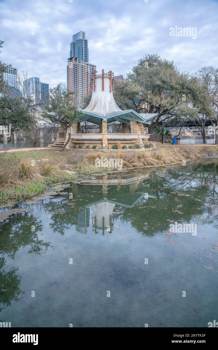 Pond with a reflection of the gazebo and trees at Auditorium Shores ...