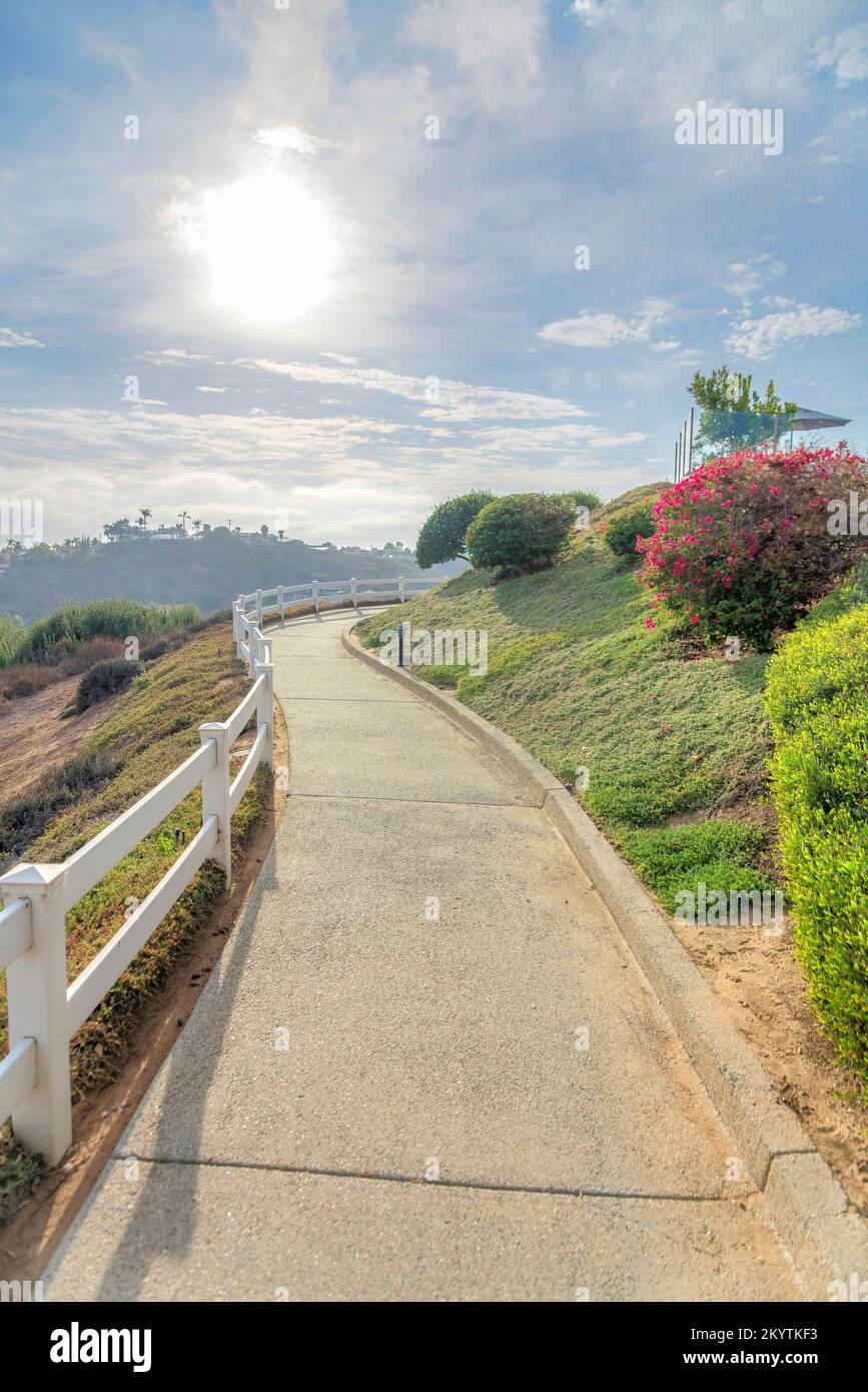 Concrete trail with railings on the edge of the slope at Southern ...