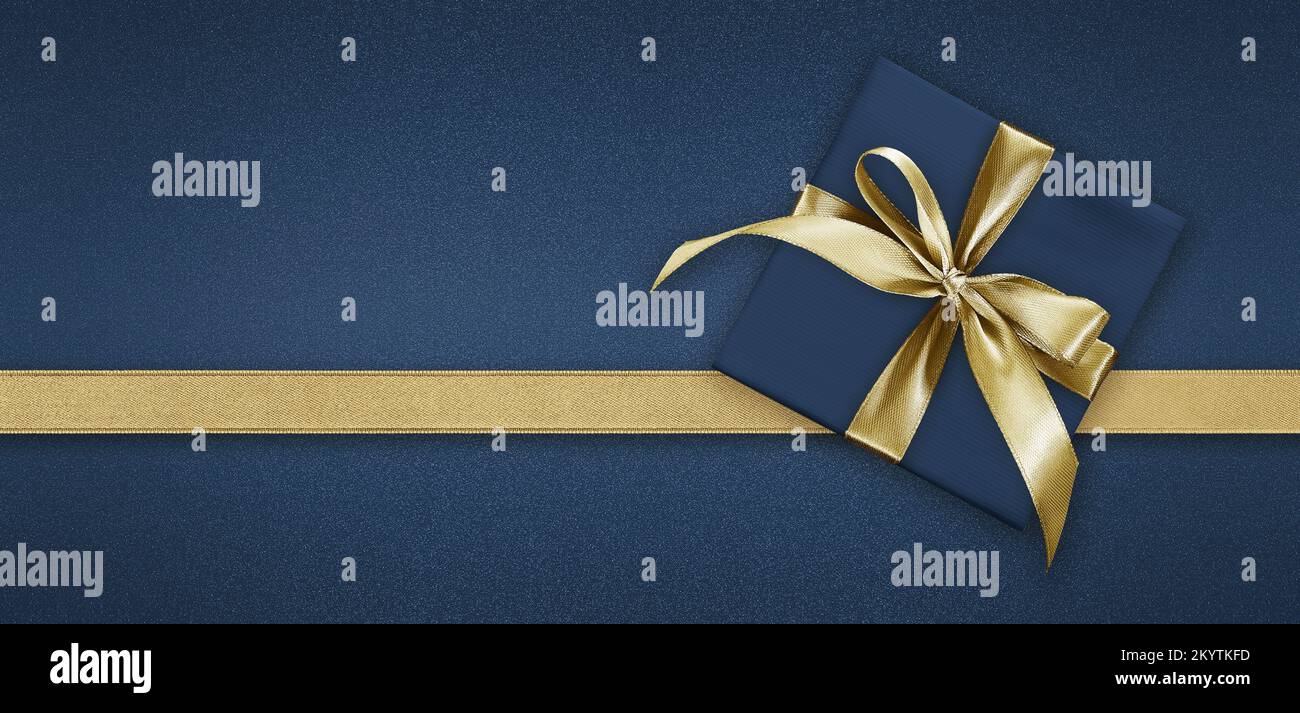 Blank gift greeting card with gift box present and bright shiny golden ...