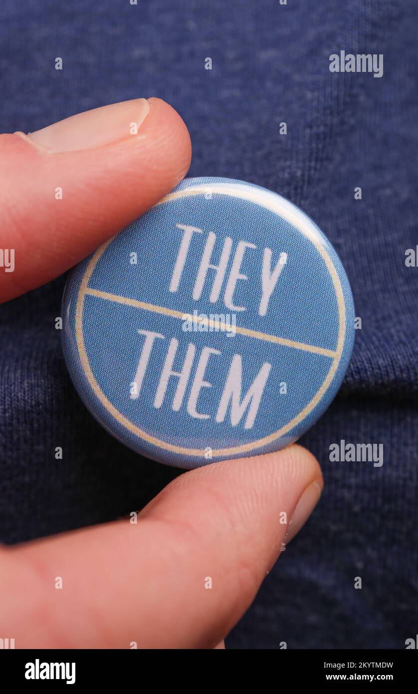 A person showing their They Them pronouns by wearing a badge Stock ...