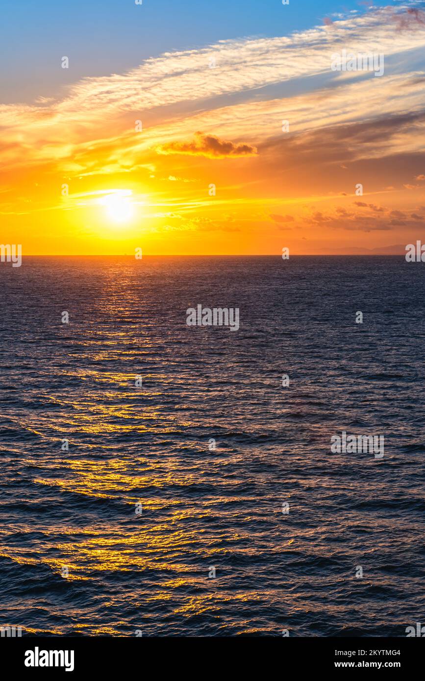 Sunset clouds over sea hi-res stock photography and images - Alamy