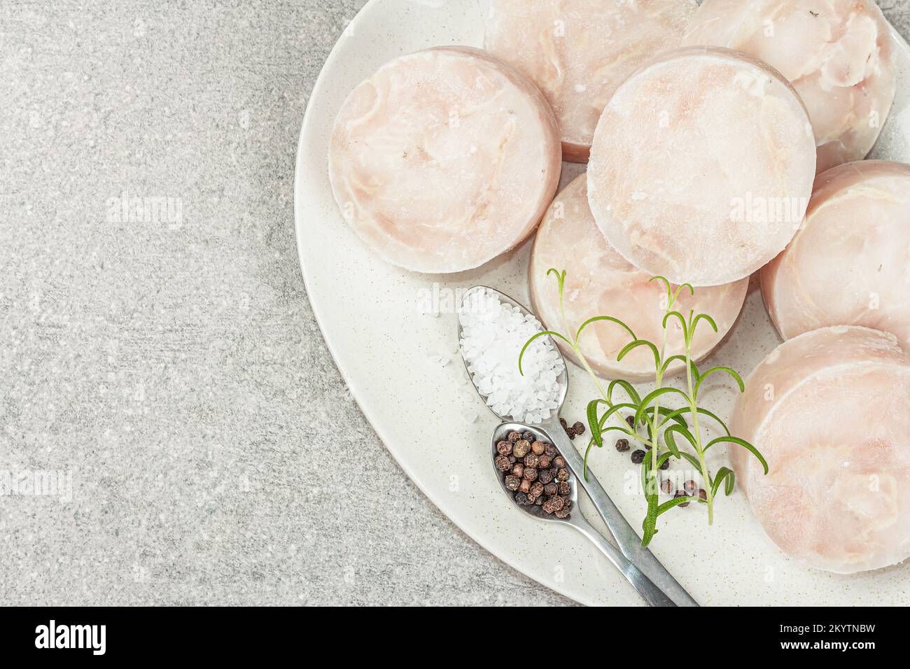 Chunks of frozen hake. Marine fish fillet on stone background, raw ...