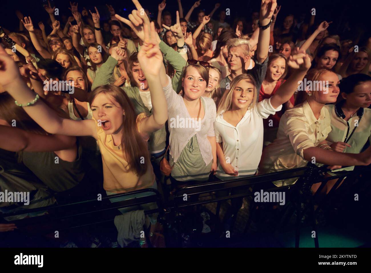 Concert, music festival and crowd with rock hands sign for singing ...