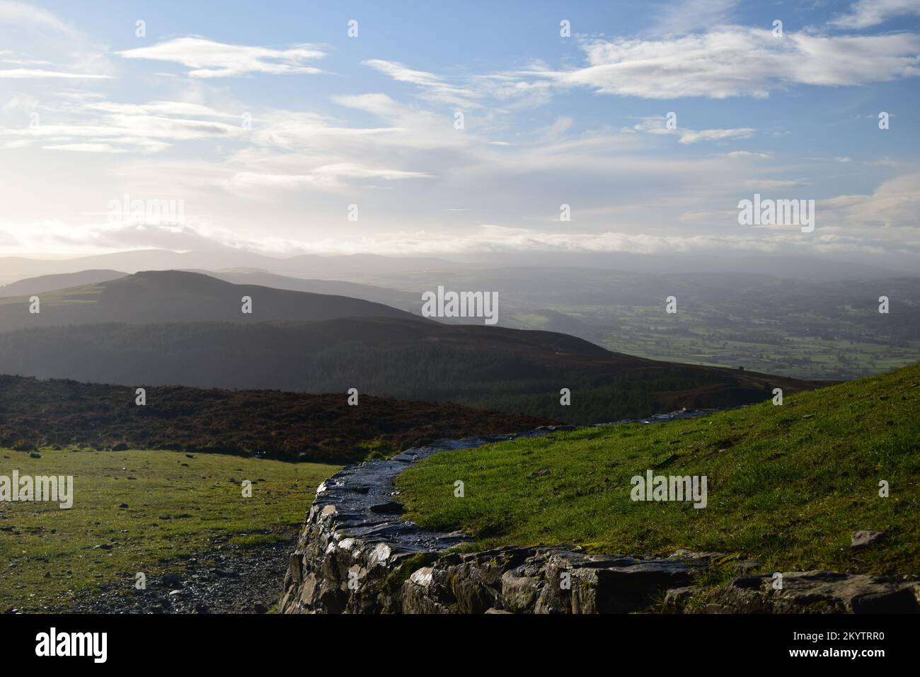 Distant views from a hilltop in Wales highlight broad sky and ...