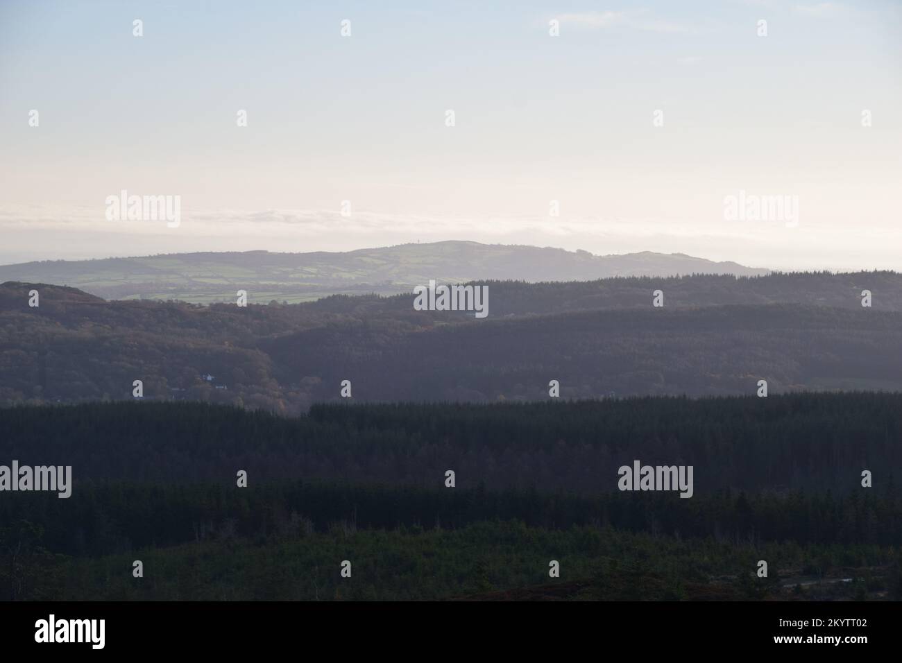 Distant views from a hilltop in Wales highlight broad sky and ...