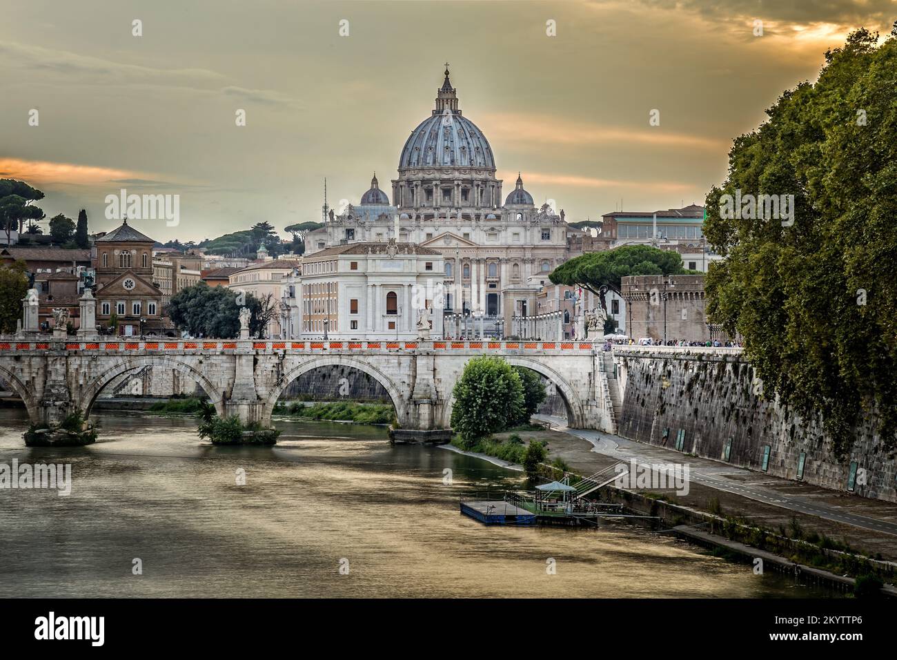 Saint Peter"s Basilica and the Santangelo bridge in the golden eveing ...