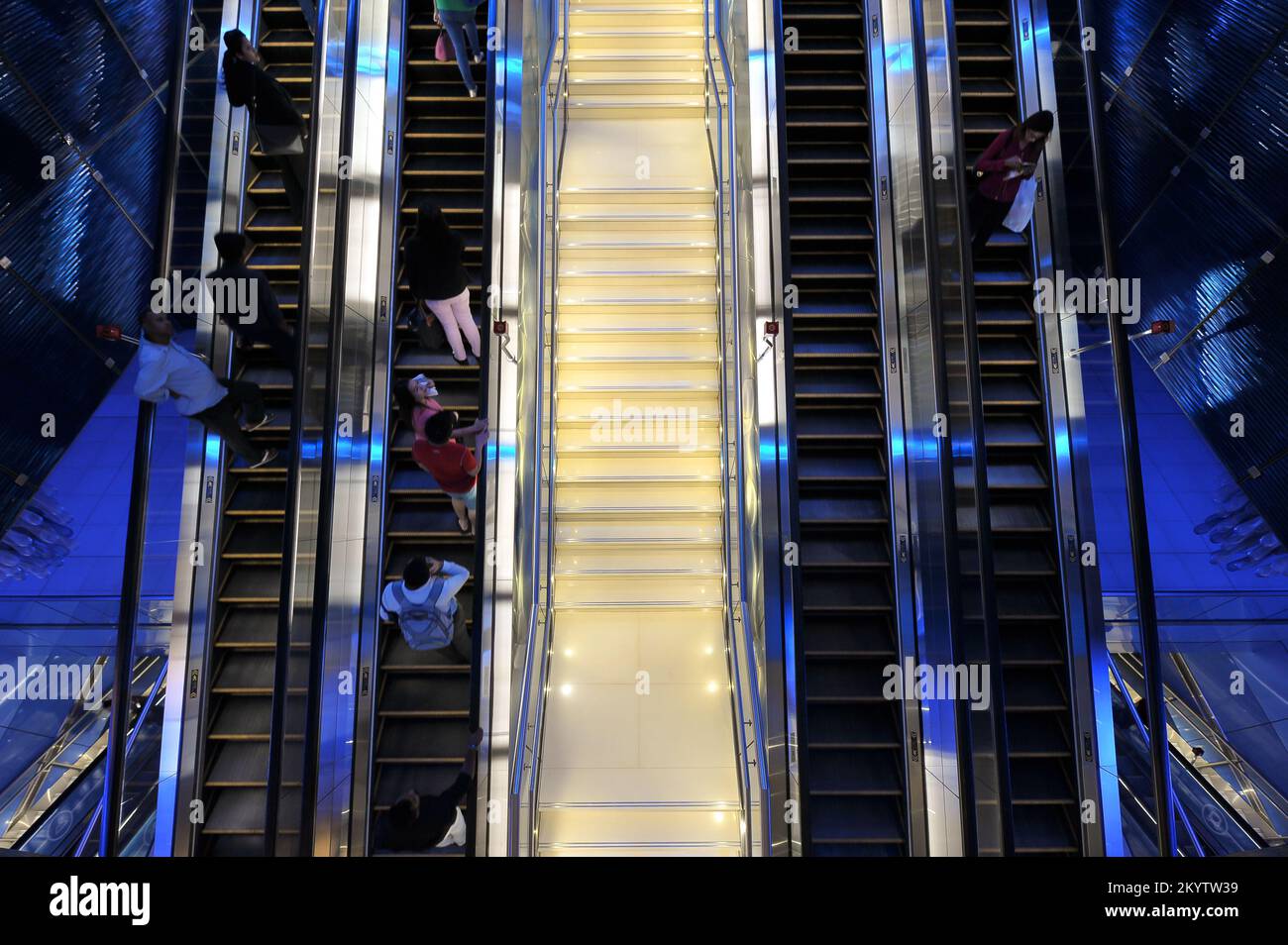 Dubai, United Arab Emirates - commuters ride bank of escalators inside ...