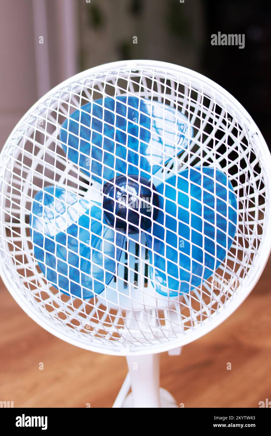 Small indoor fan on the background of the room Stock Photo - Alamy