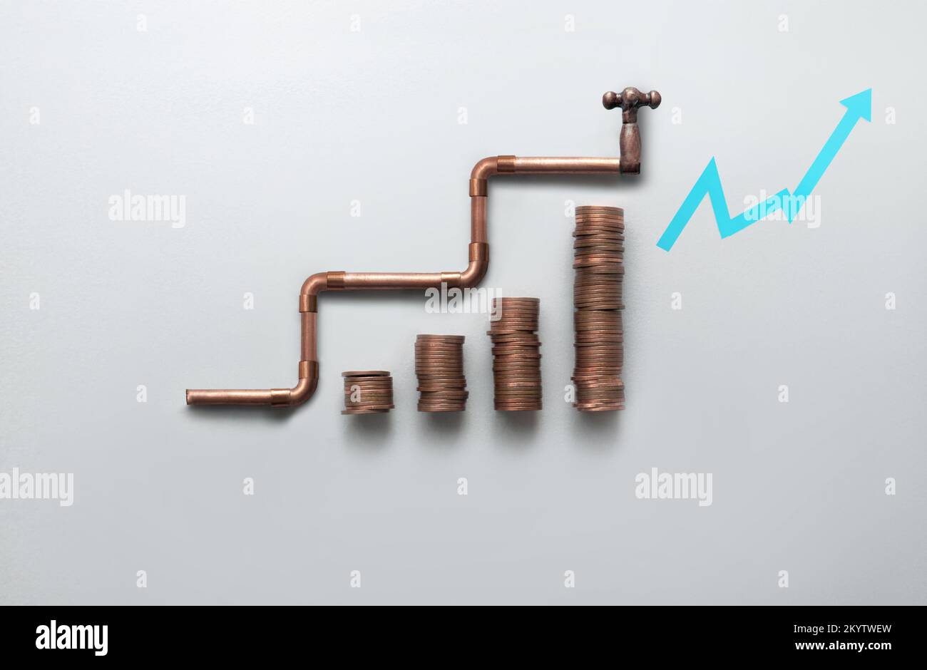 Copper piping with tap rising upwards alongside stacks of coins, arrow increase in energy bills ...