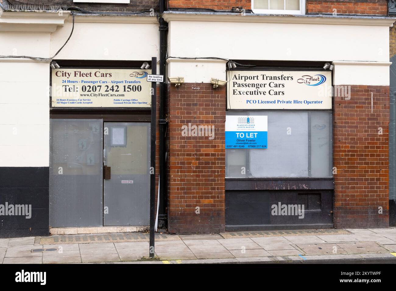 A closed down shop with its windows boarded up, Clerkenwell Road ...