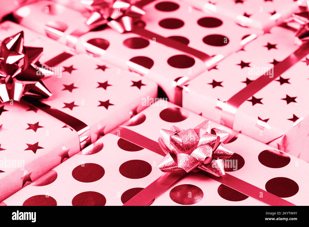 Composition of wrapped Christmas gift boxes with bows and ribbon ...