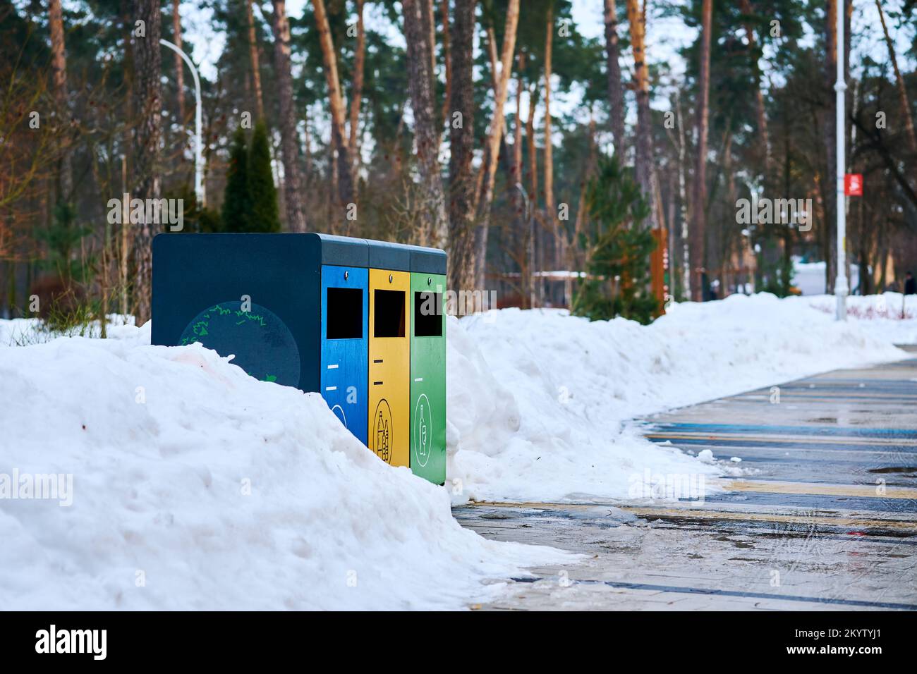 Garbage separate containers for plastic, paper and glass in a winter ...