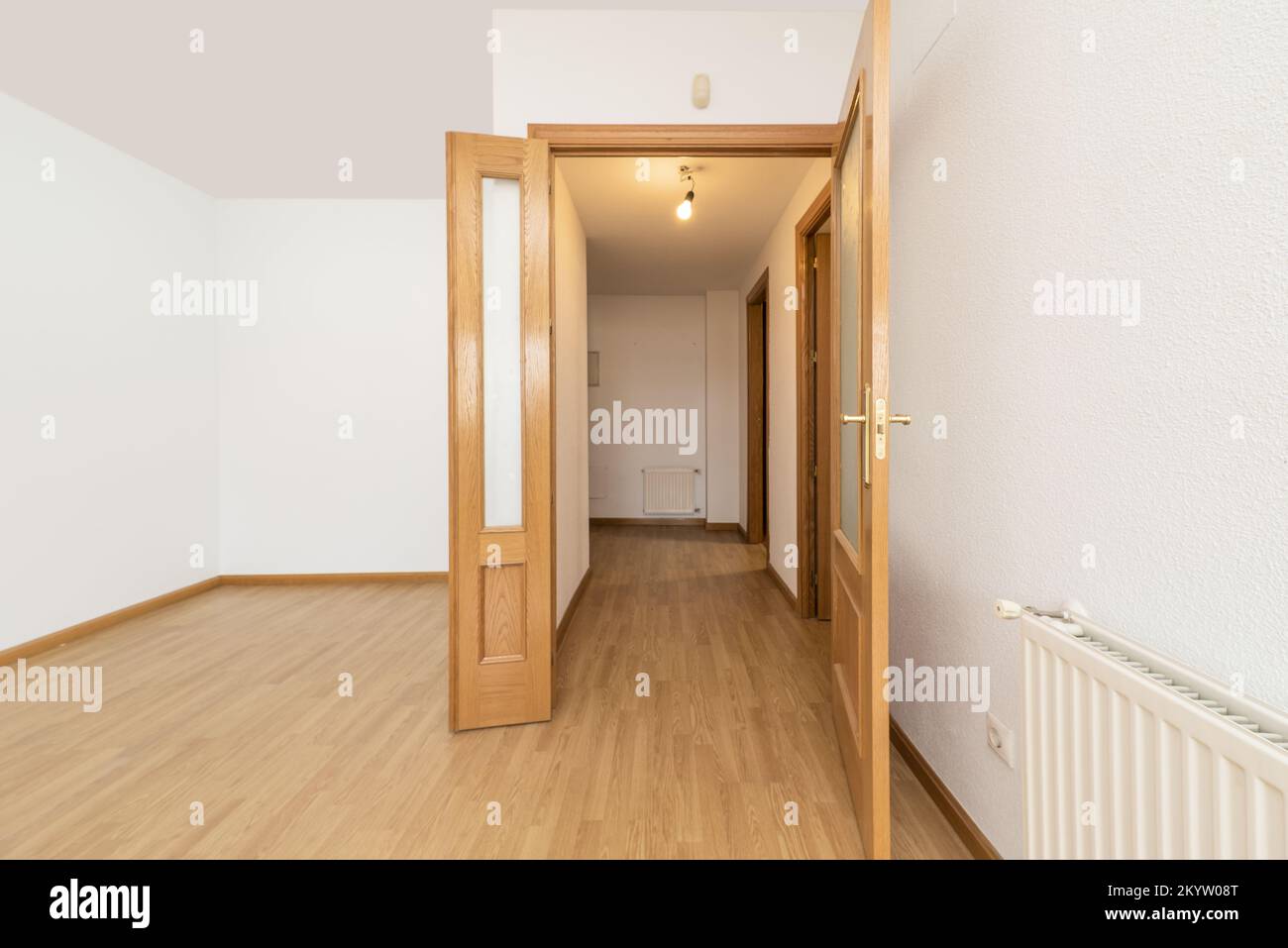 Living room of a house with oak access doors and matching laminated ...