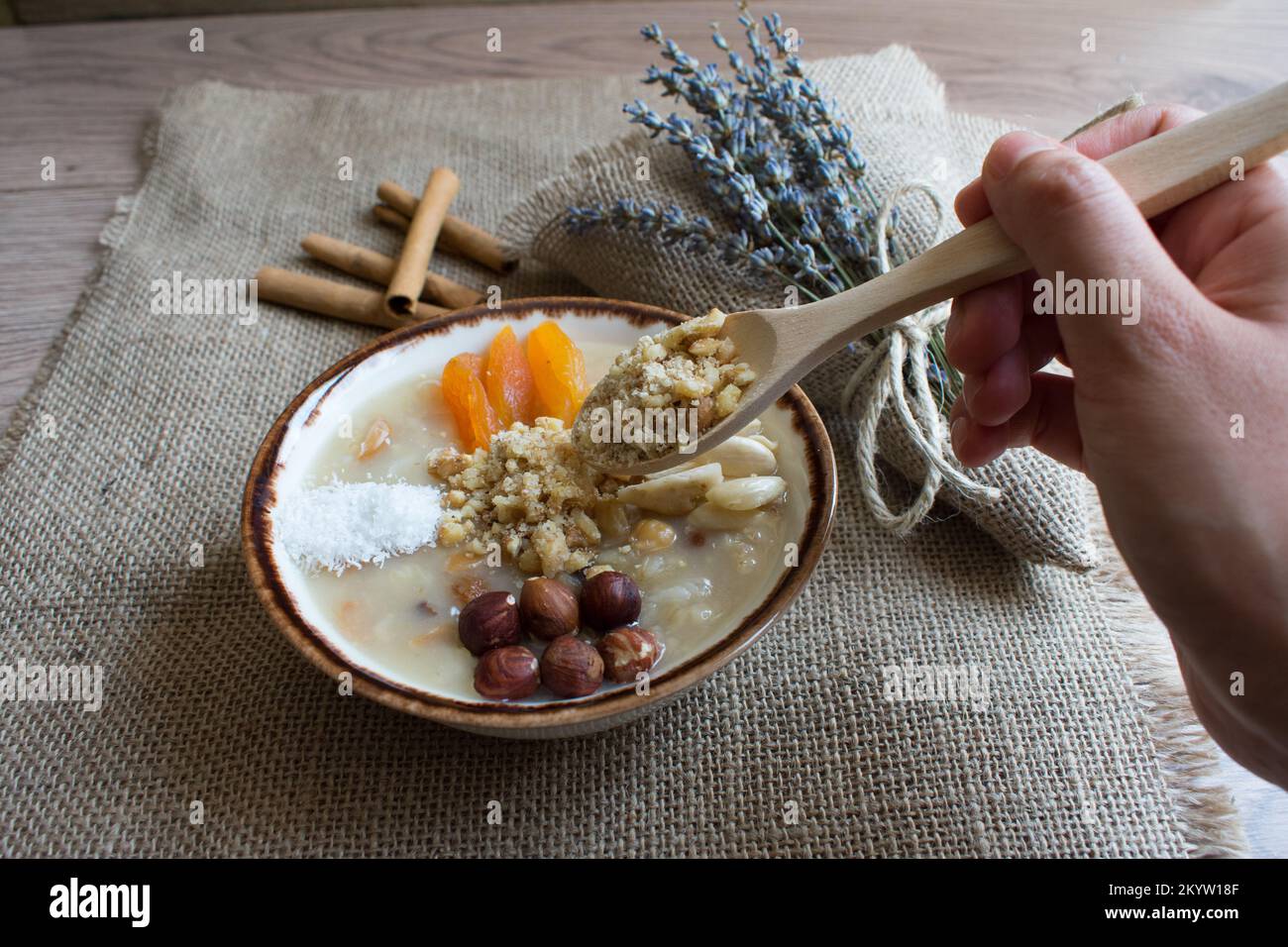 Traditional Turkish dessert Ashura.Walnuts, almonds, dried apricots ...