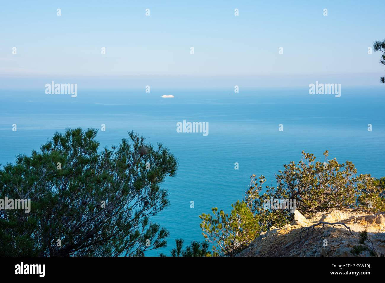 Beautiful rocky coast in blue Mediterranean sea Stock Photo - Alamy
