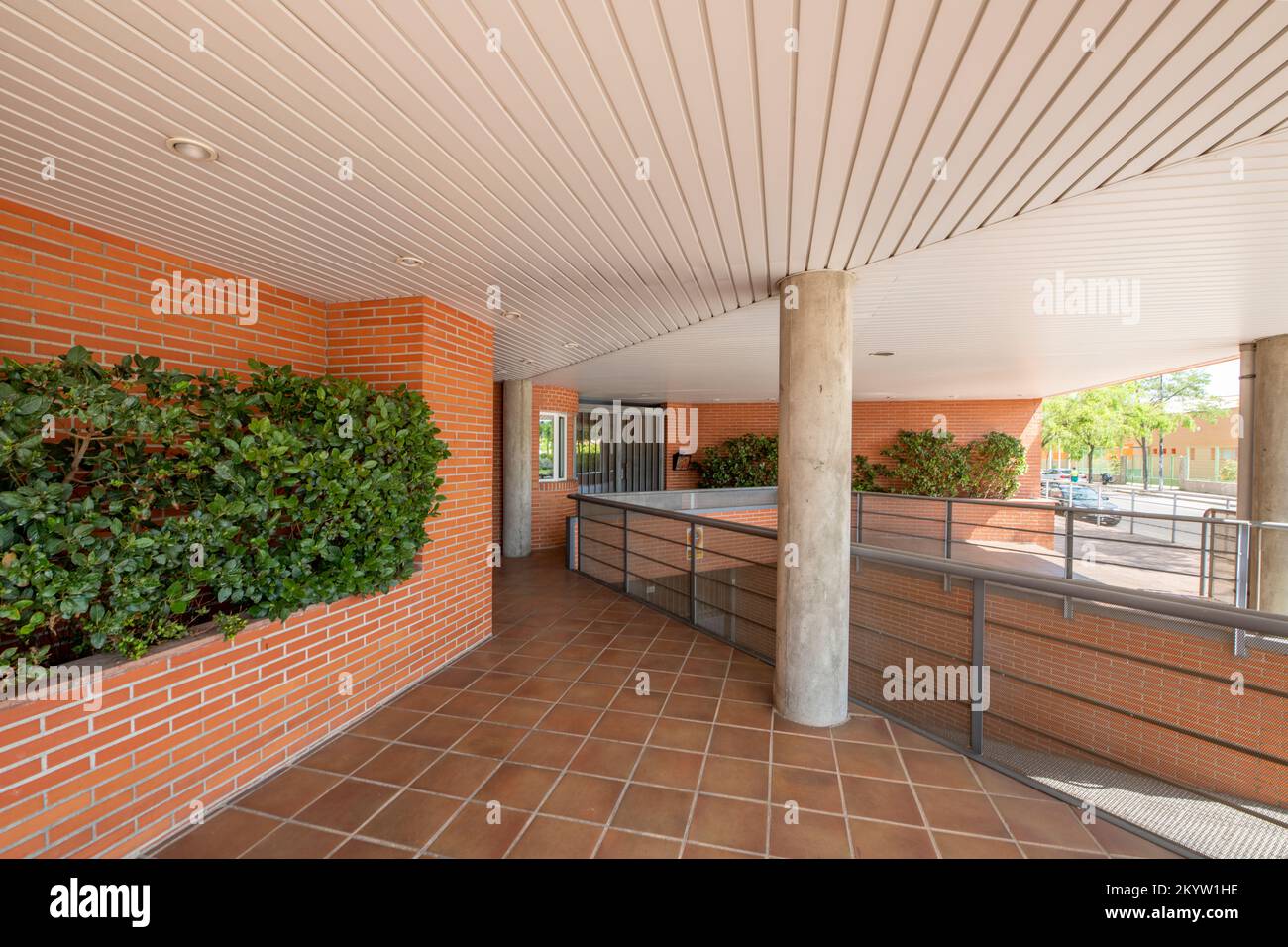 Exterior area of a residential portal with exposed brick walls, large ...