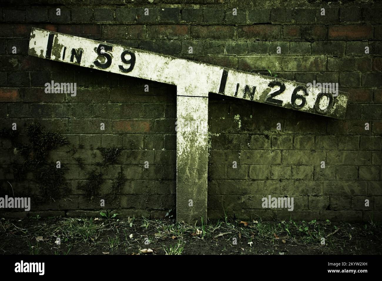 Old British railway gradient post signifying 1 in 59 and 1 in 260 ...