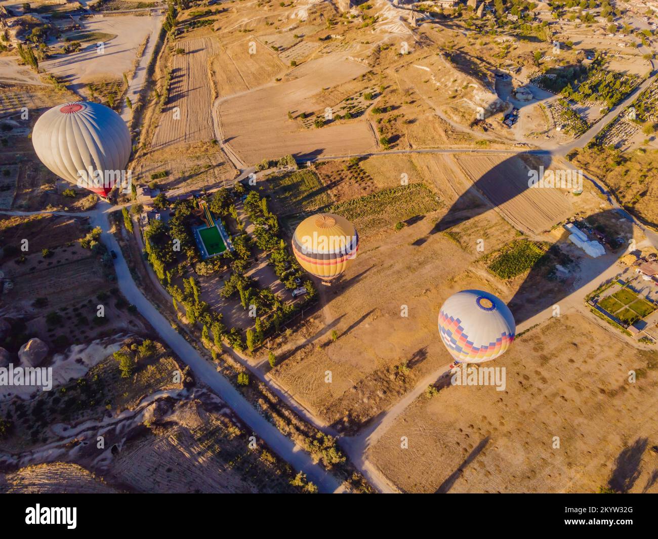 Colorful hot air balloons flying over at fairy chimneys valley in ...