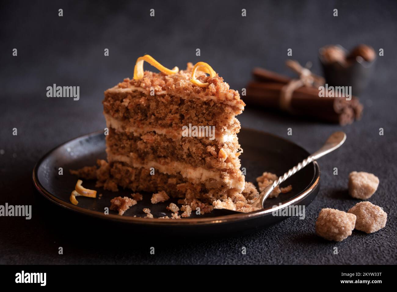 A slice of delicious homeade winter cake with walnus and cinnamon Stock ...