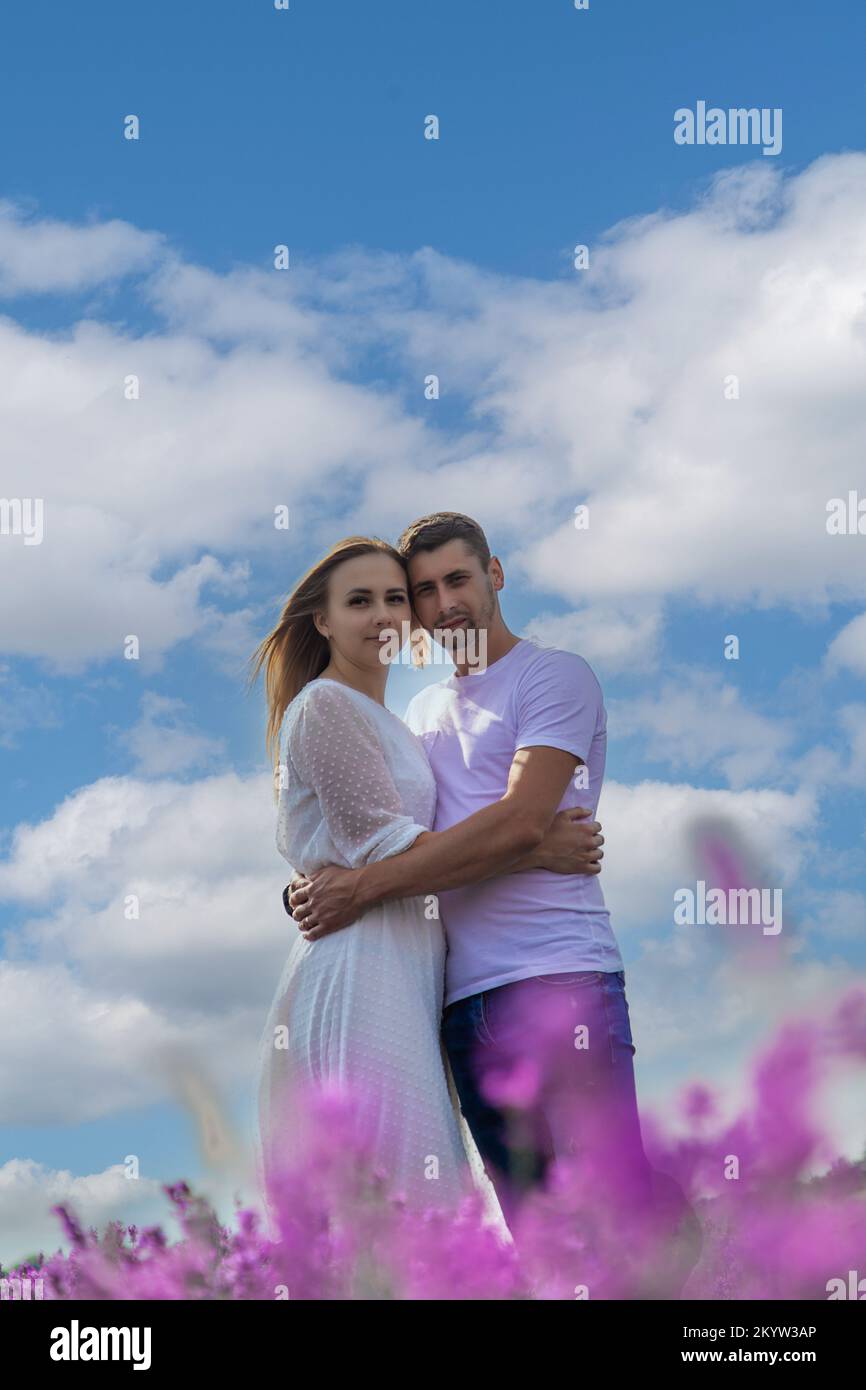 Beautiful purple lavender flowers in a summer field. couple holding ...