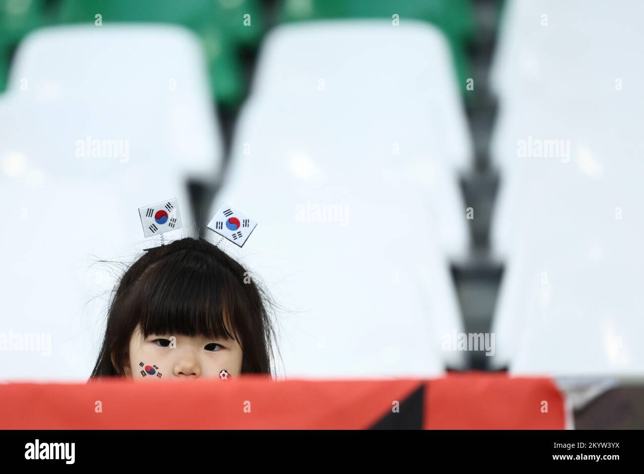 Al Rayyan, Qatar. 2nd Dec, 2022. A Korean girl waits for the start of ...