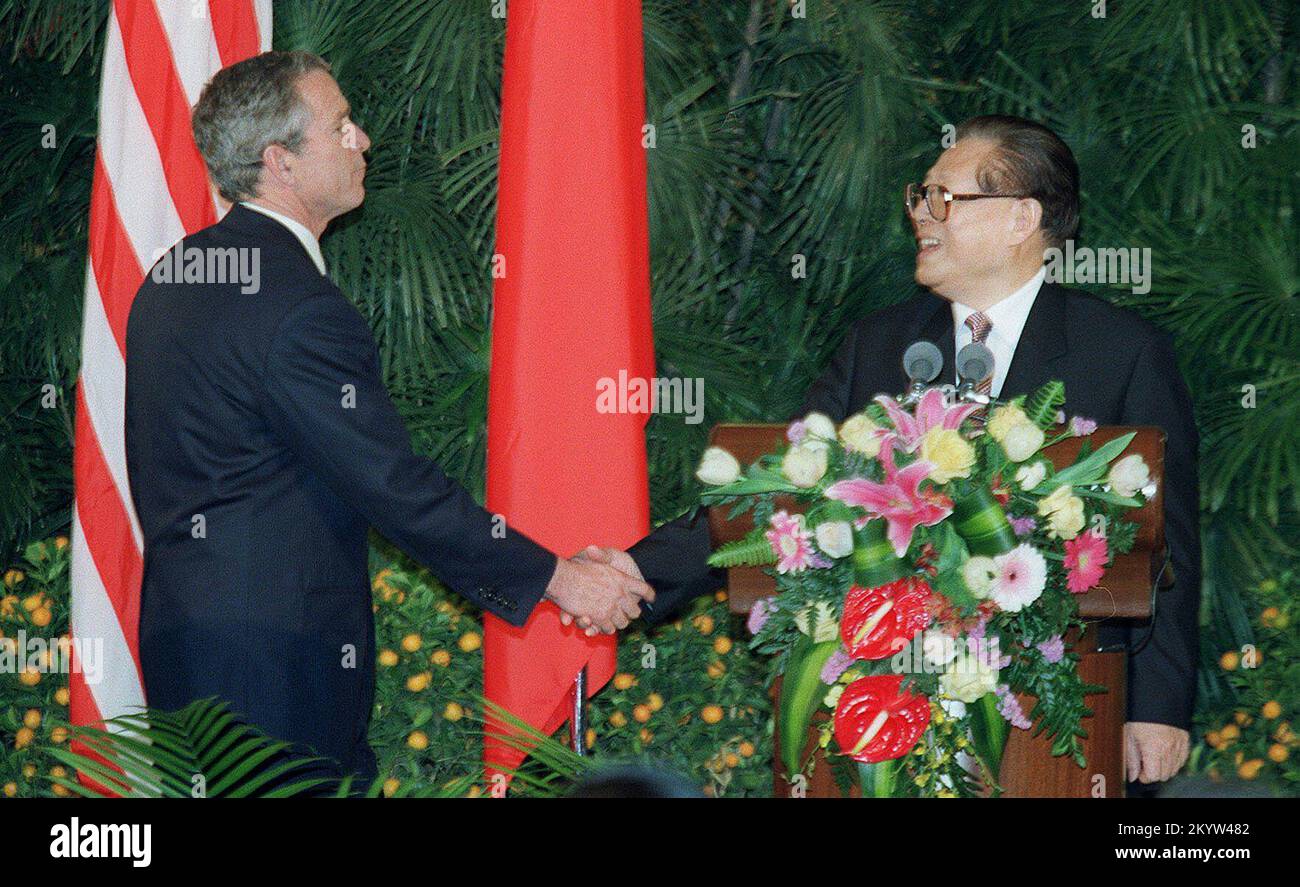 American President George W. Bush shakes hands with the Chinese ...
