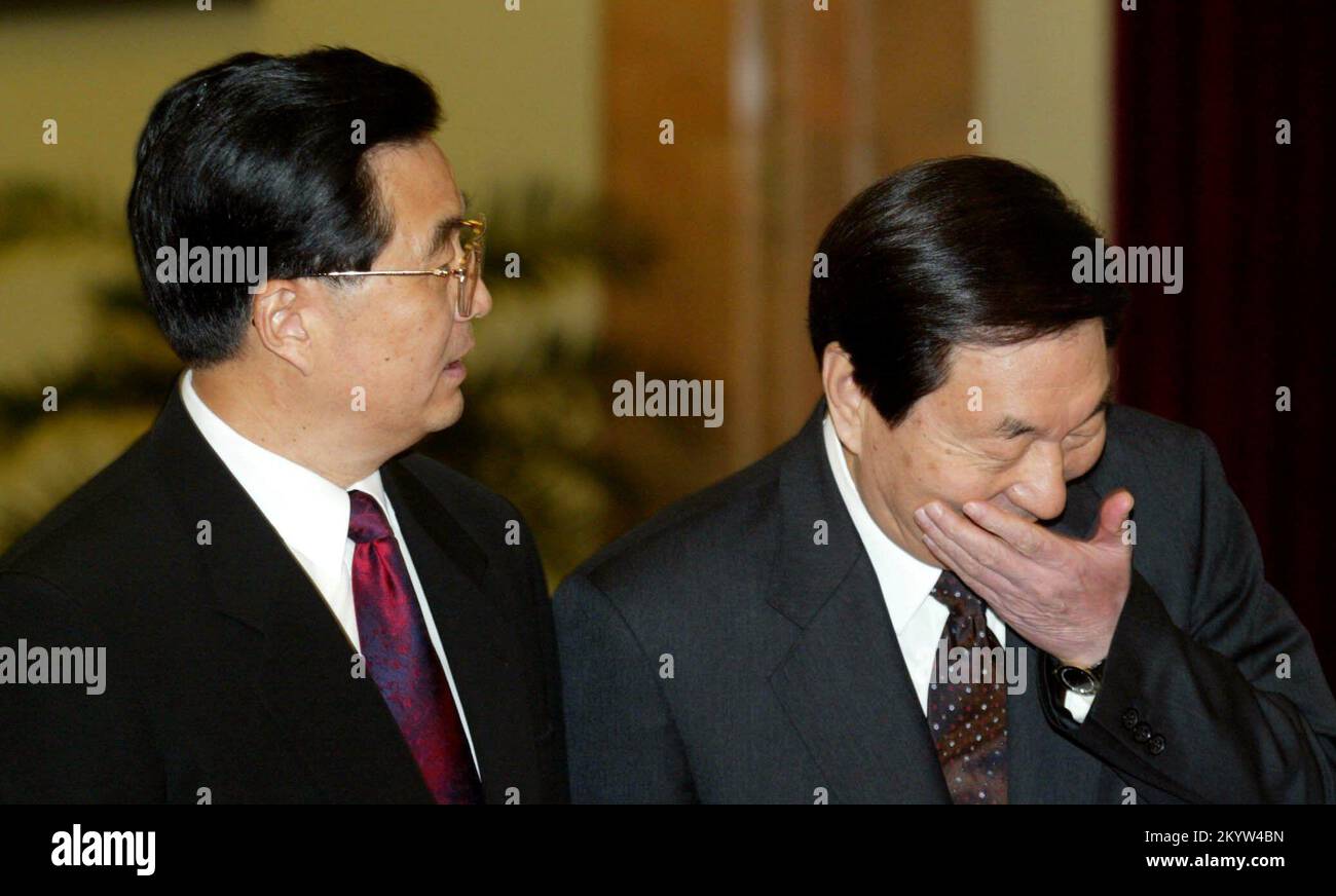 Chinese Vice-President Hu Jintao (L) shares a joke with Premier Zhu ...
