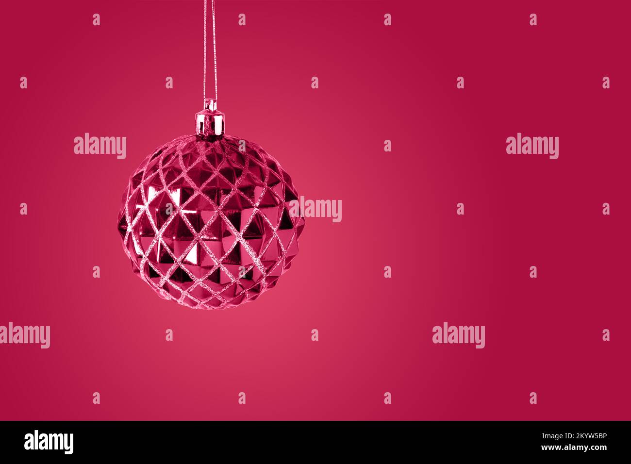 Christmas purpur or viva magenta color ball on monochrome background ...