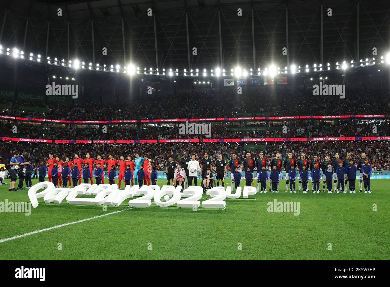 Al Rayyan, Qatar. 2nd Dec, 2022. Players and referees stand on the ...