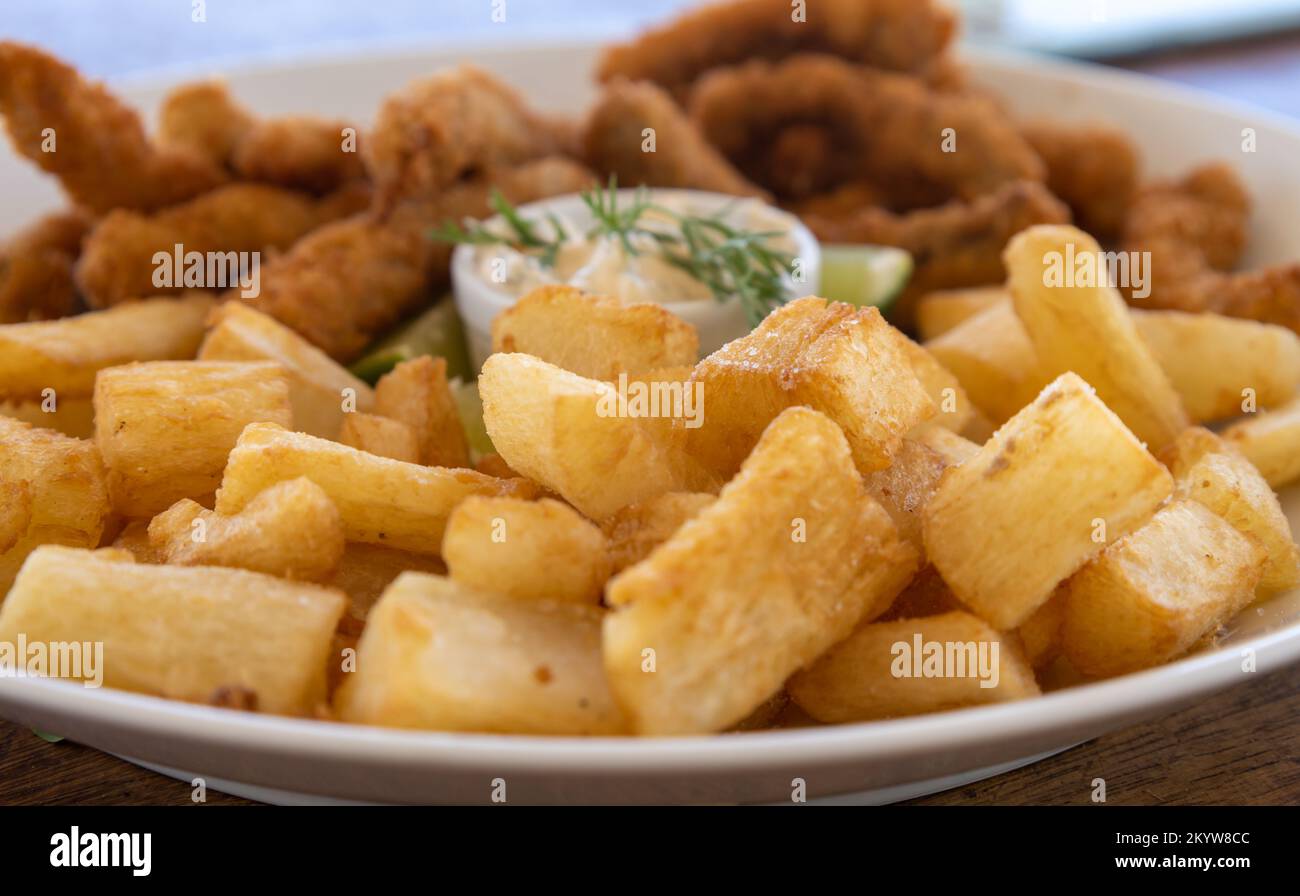 Delicious dish with fried manioc. Junk food to eat with your hand. High ...
